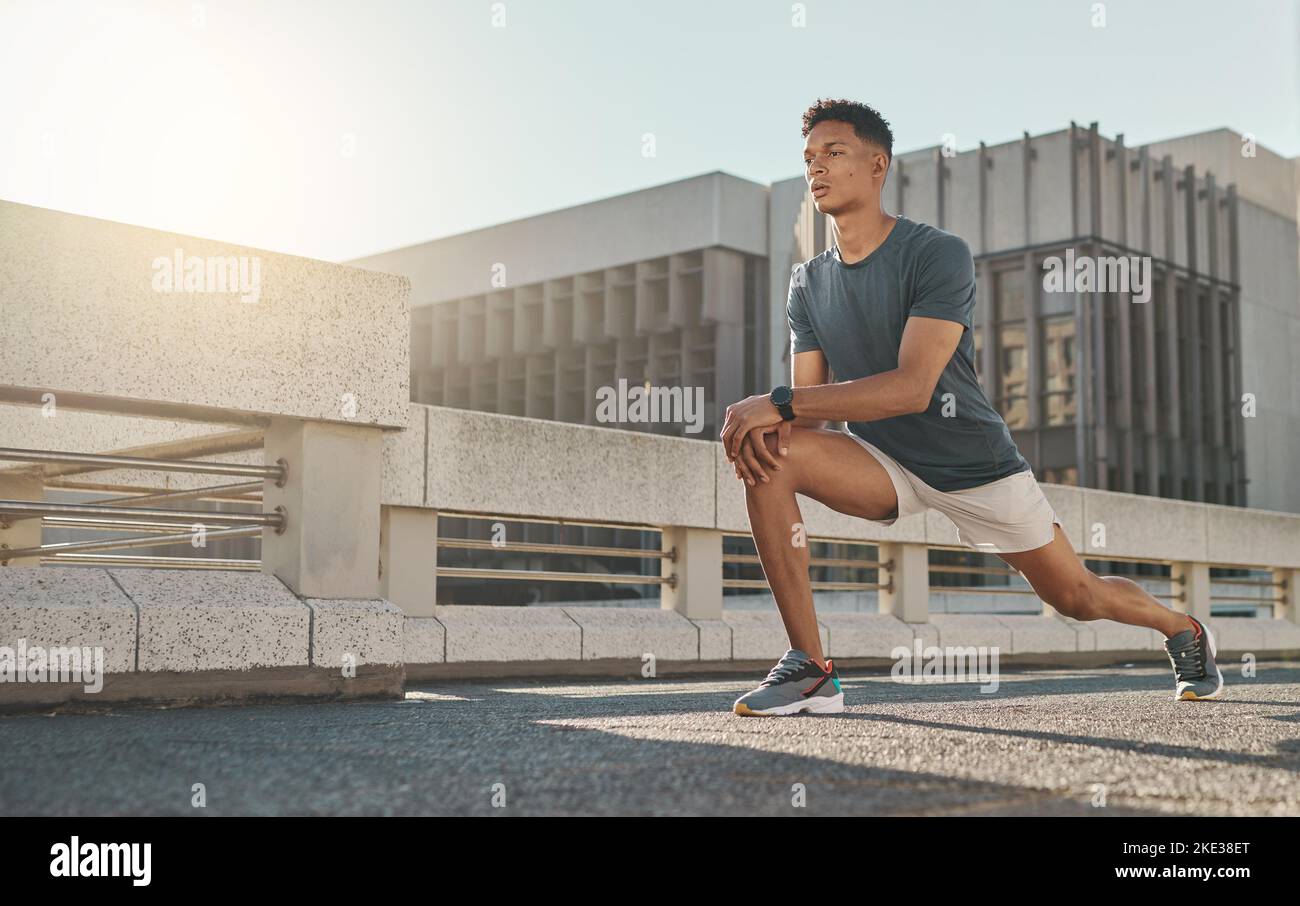 Fitness, exercise and man stretching in city before running workout ...