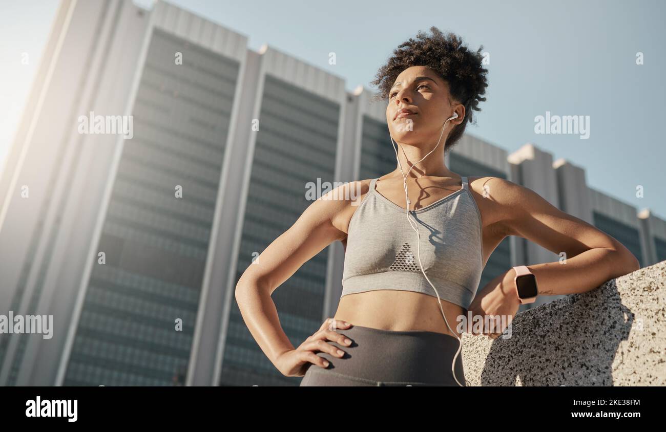 Fitness, music and city black woman thinking of training, running or ...