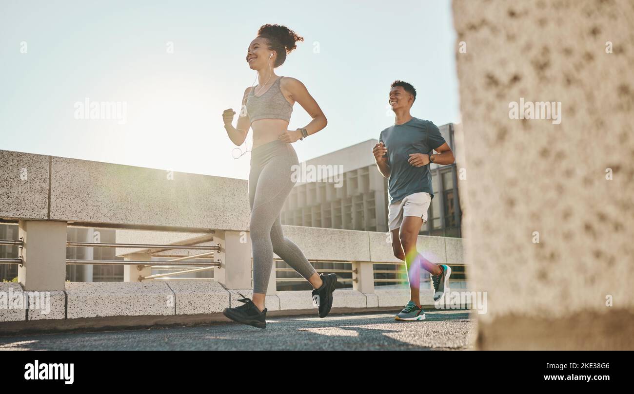Fitness, couple and running workout in city, urban town and sunshine ...