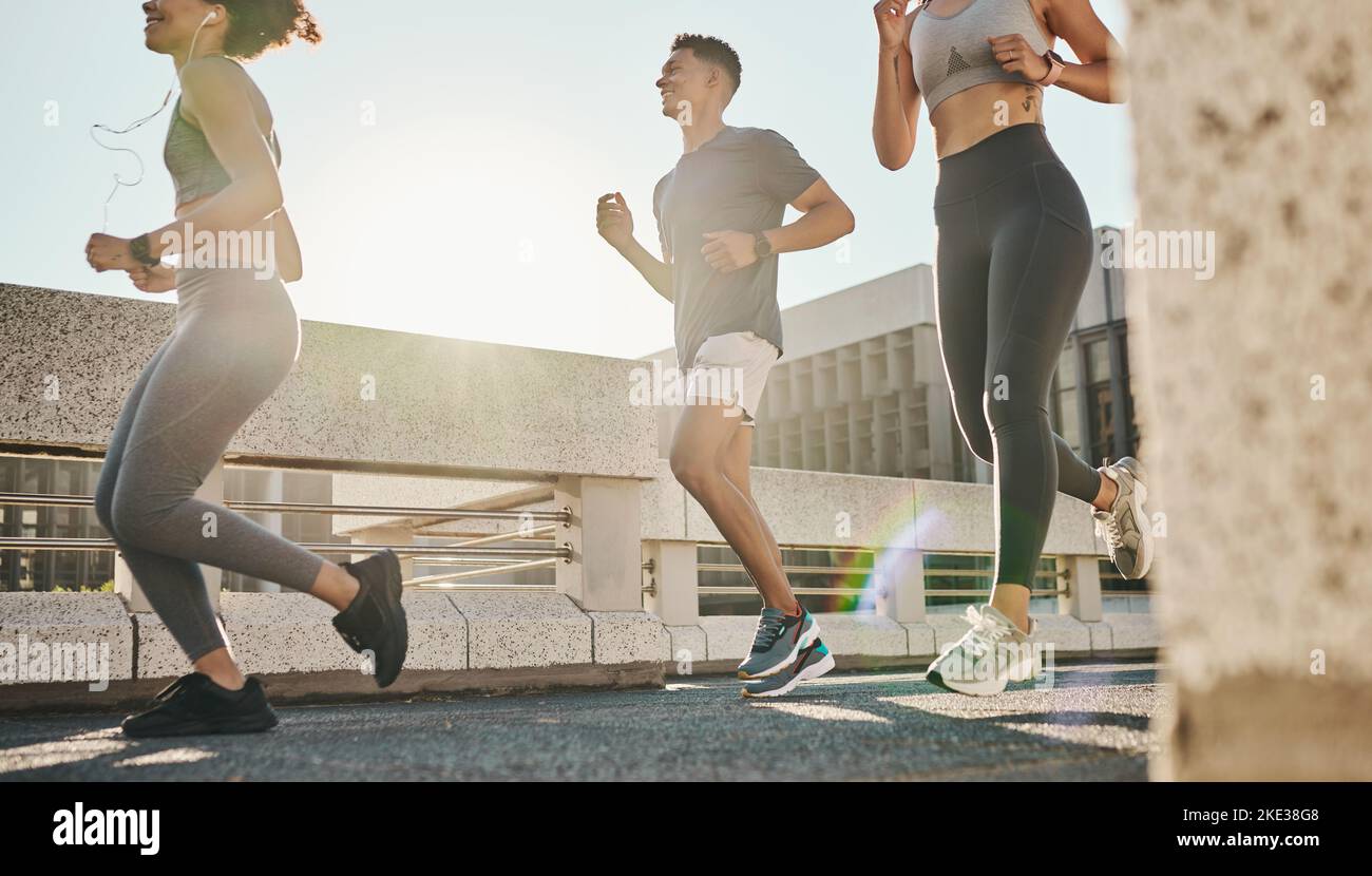 City, fitness and friends running on a road for a cardiovascular ...