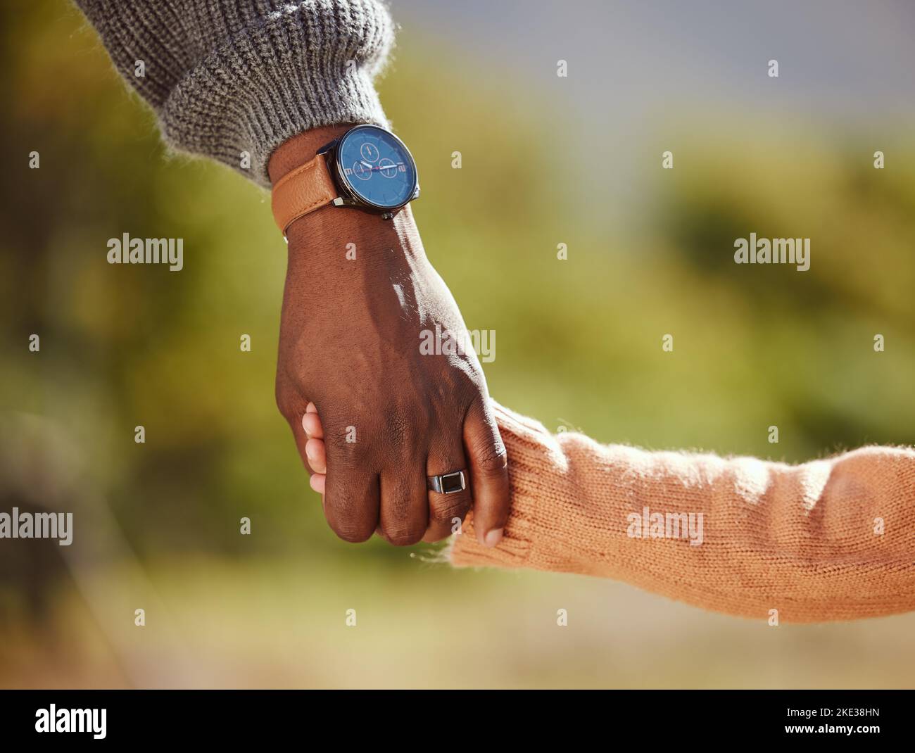 Family, love and child holding hands with parent in nature, outdoor ...