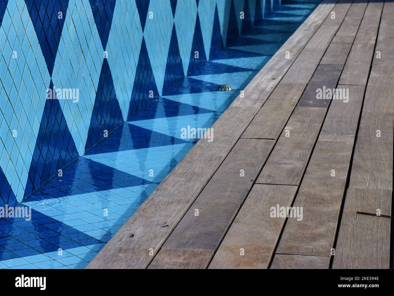 Straight lines and shapes for this waterfall swimming pool by the beach ...