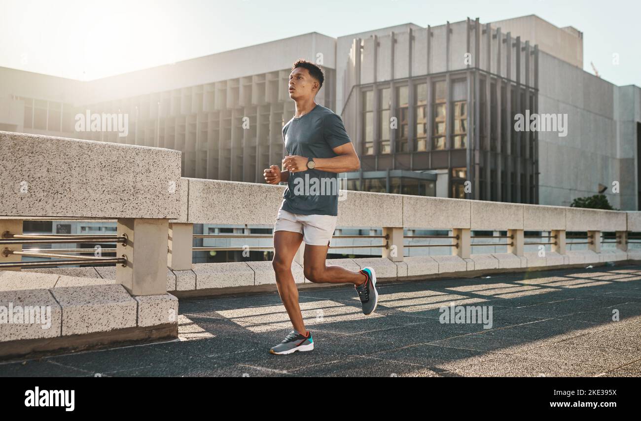 Fitness, health and city man running on street with motivation, healthy ...