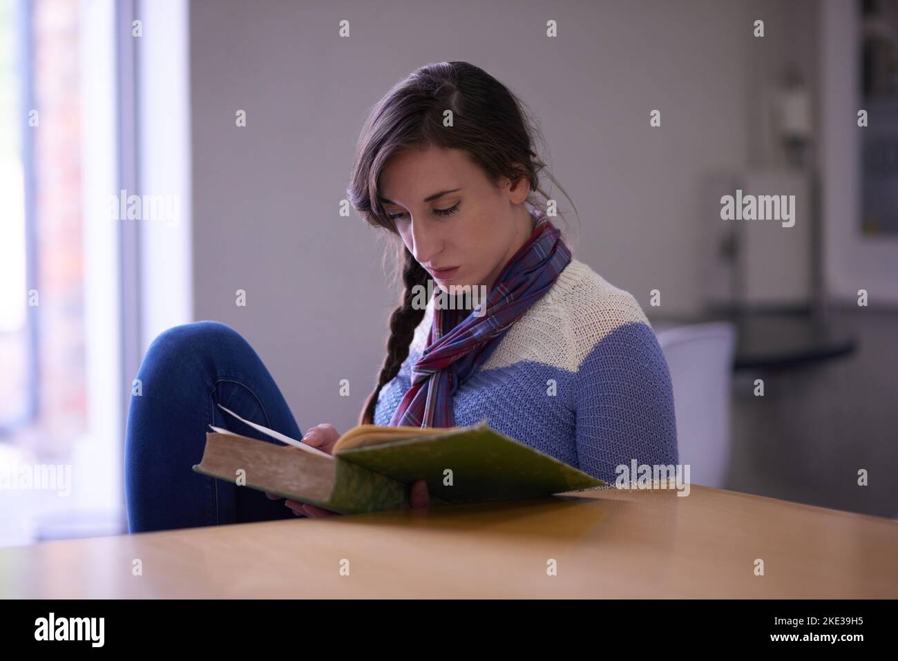 Reading up on some notes for her next class. a university student ...
