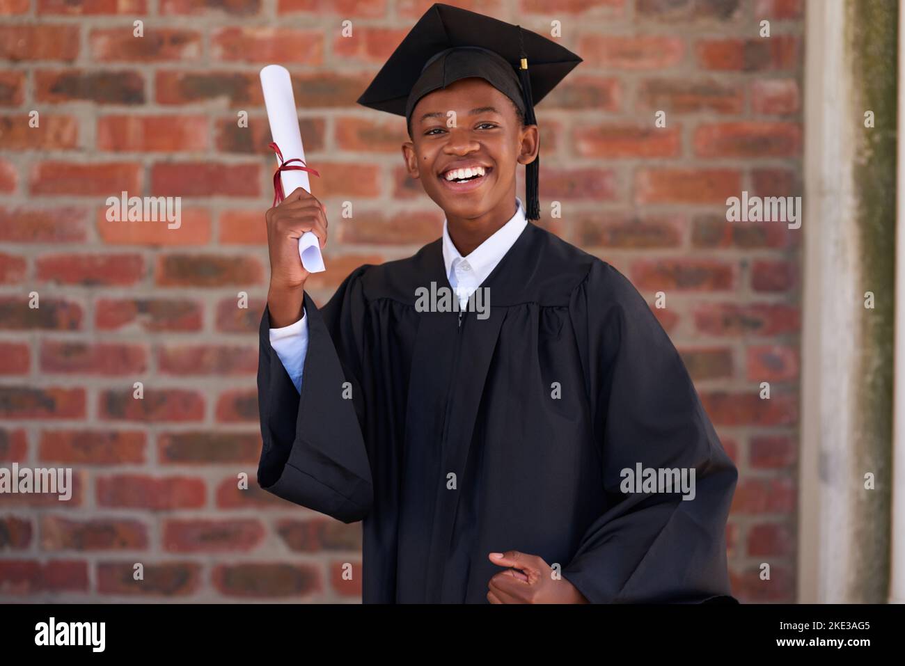 Im qualified. Portrait of a happy male student standing with his ...