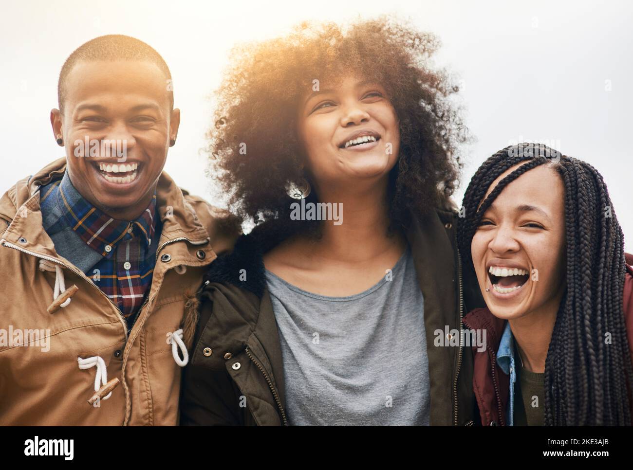 Triple the fun. Portrait of a group of happy friends posing together ...
