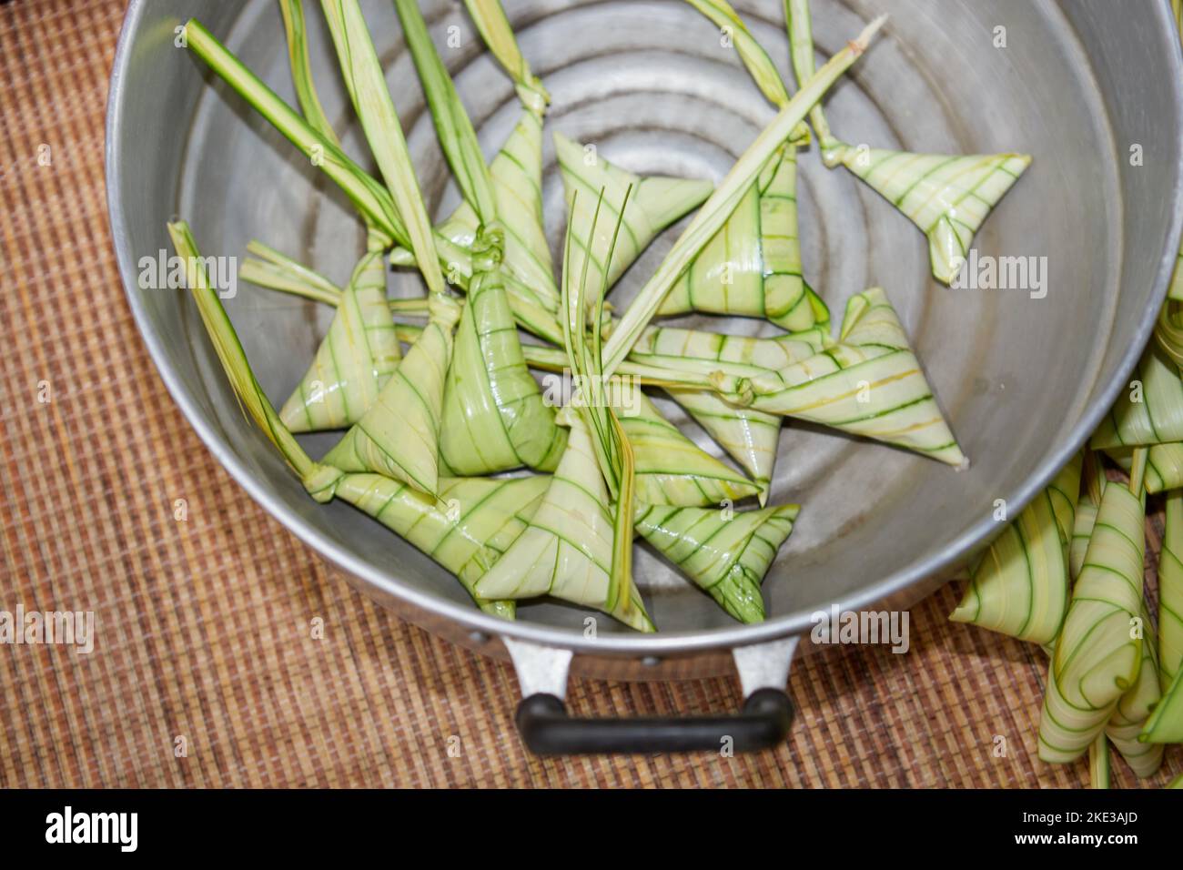 Preparing of the triangular sticky rice wrapped with palm leaf or ...