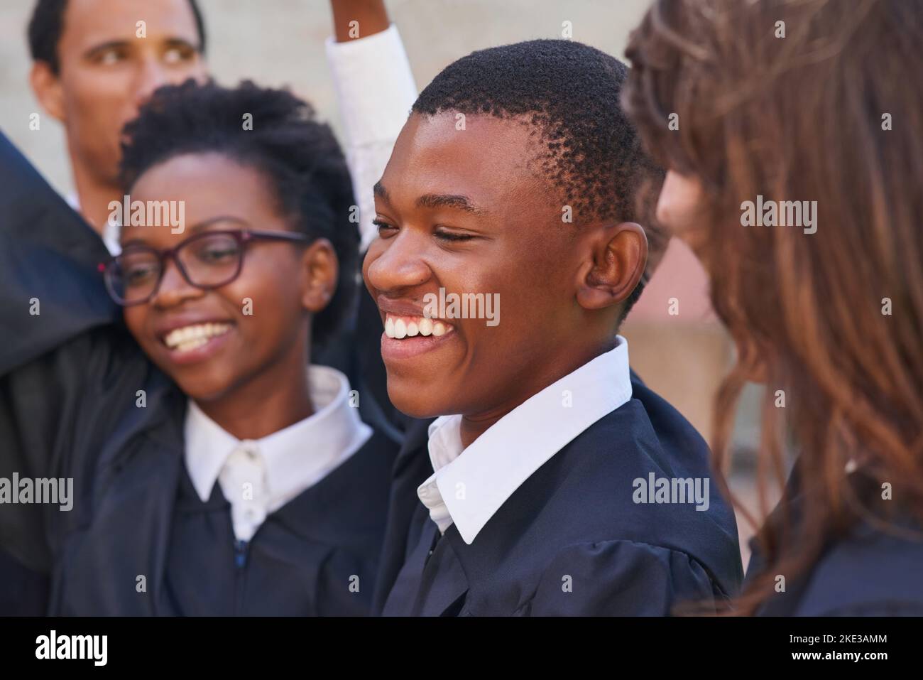 Enjoying their graduation day. a happy group of students standing ...