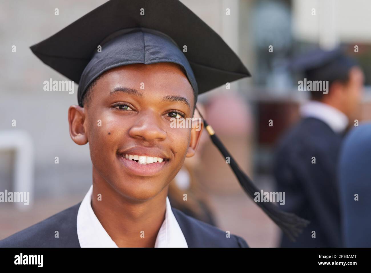 Hard work pays off. Trust me I know. Portrait of a happy male student ...