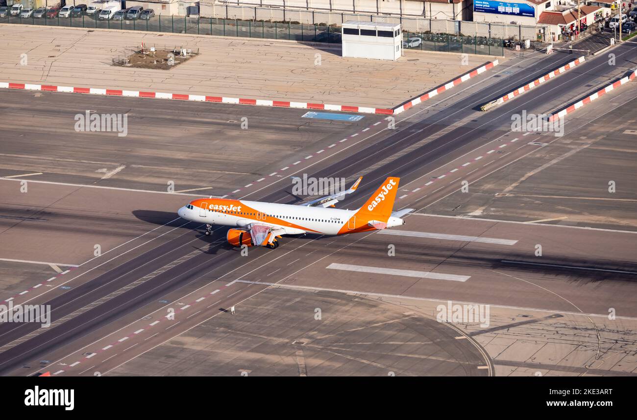 EasyJet Airplane landing to the airport during sunny morning. Aerial ...