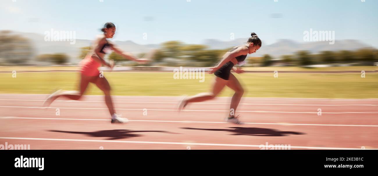 Sports, fitness and relay race with a woman athlete passing a baton to ...
