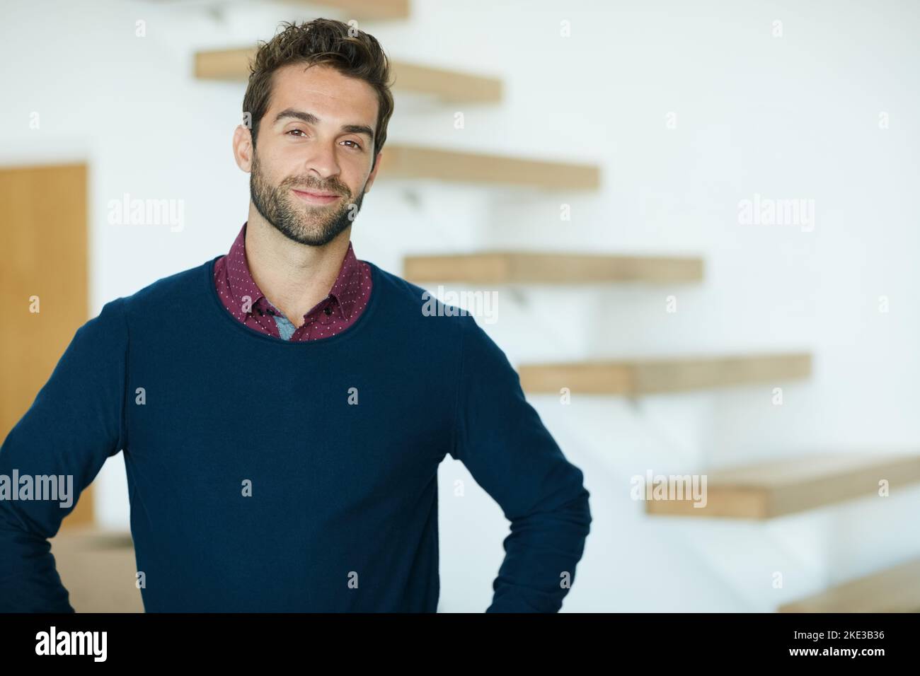 It feels good to be in charge. Portrait of a happy creative businessman ...