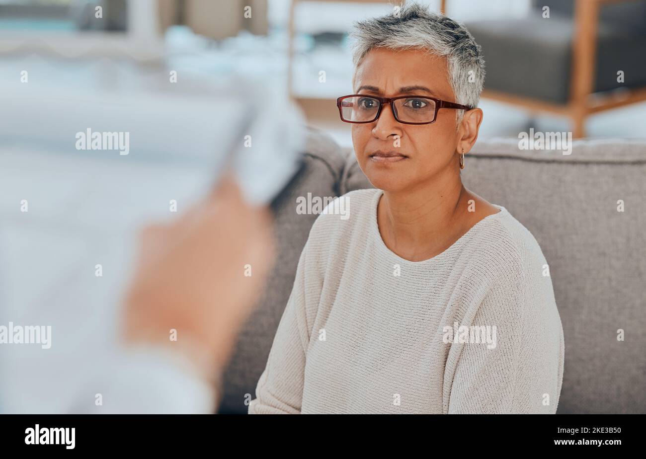 Senior woman, worried and stress while on living room sofa thinking and ...