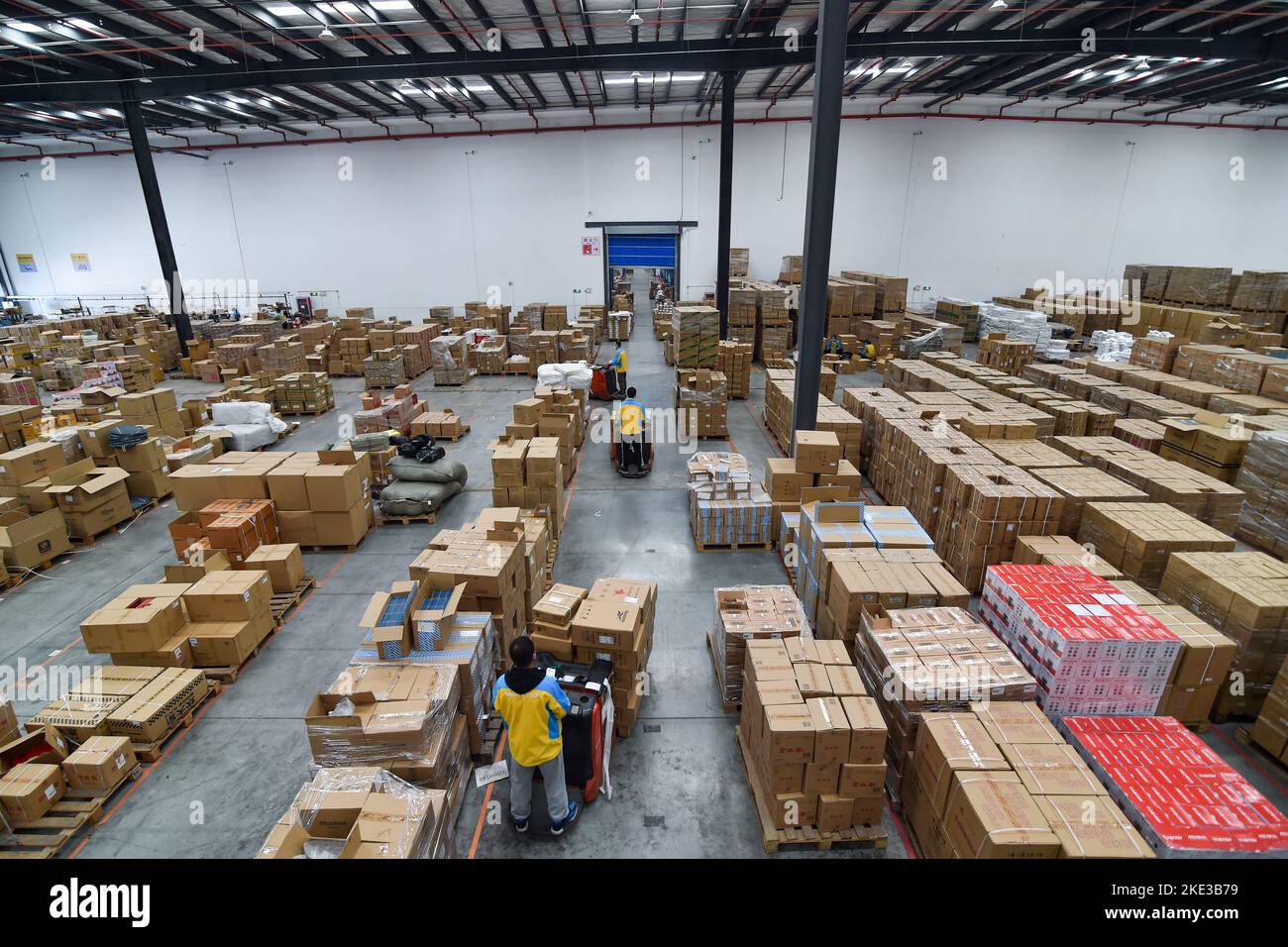 NANJING, CHINA - NOVEMBER 10, 2022 - A worker moves goods with a forklift at Suning East China ...
