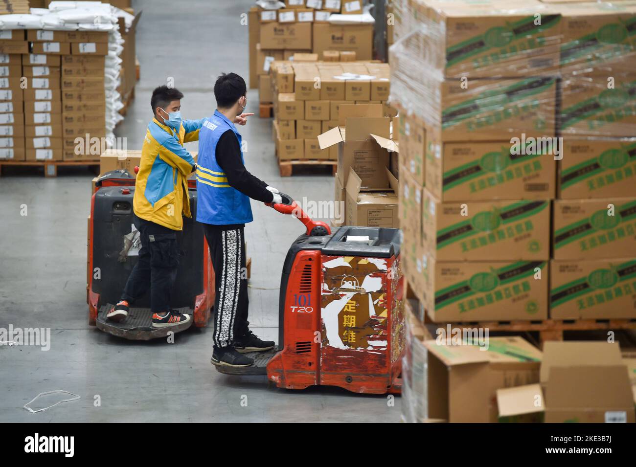 NANJING, CHINA - NOVEMBER 10, 2022 - A worker moves goods with a ...