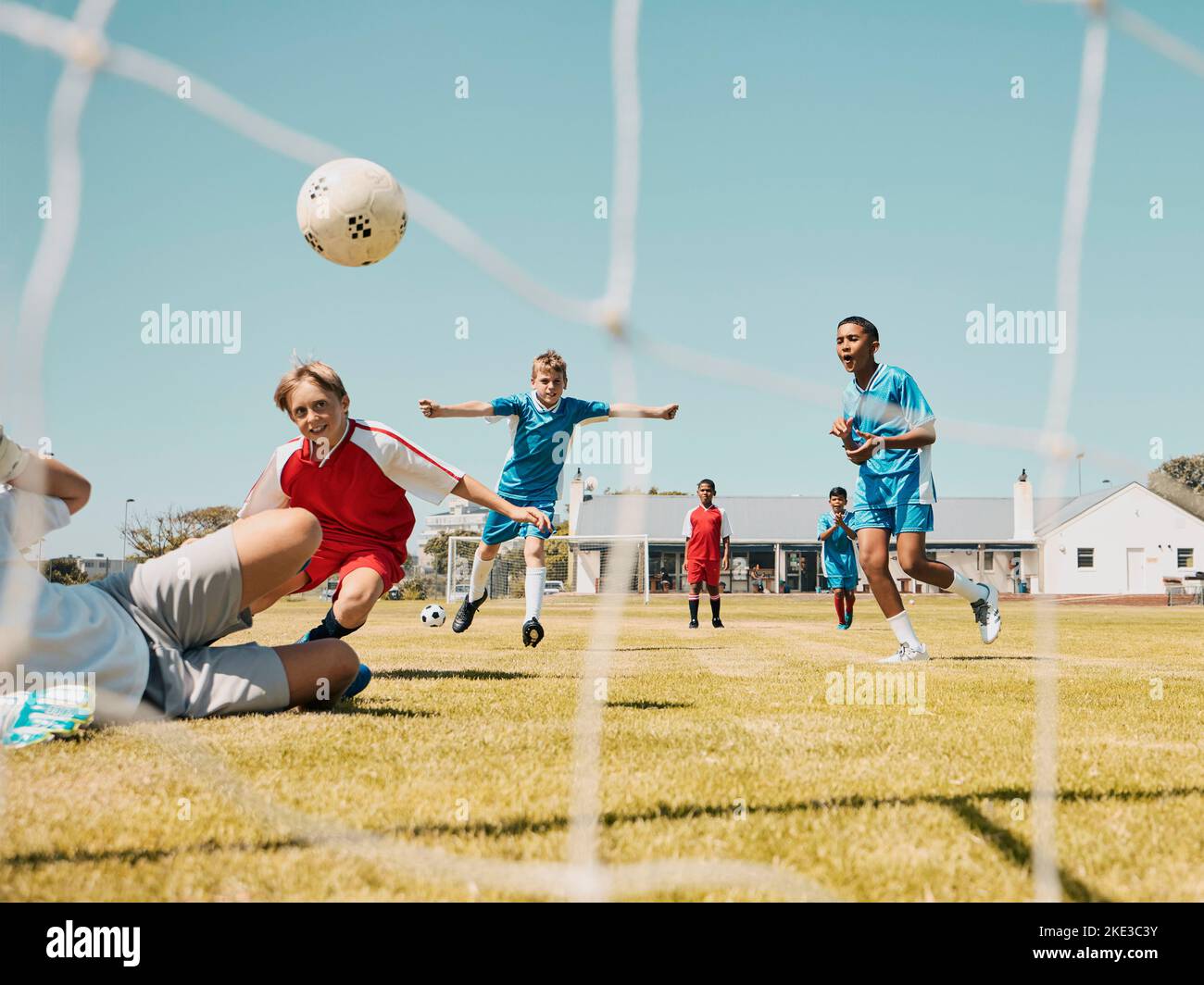 Children playing soccer on sports field hi-res stock photography and ...