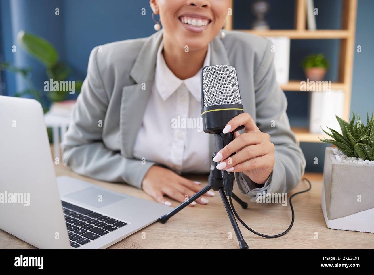 Podcast, laptop and microphone woman with broadcast, news update or ...