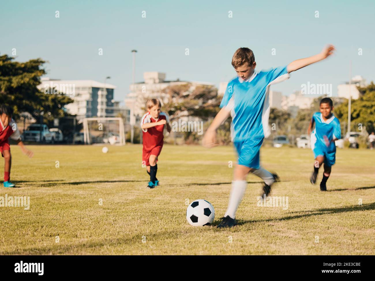 Children playing soccer in field hi-res stock photography and images ...