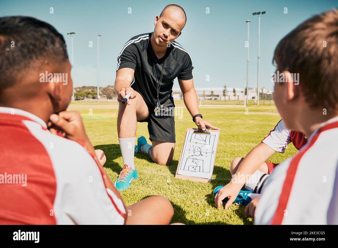 Soccer team, children and coach with clipboard while talking workout ...