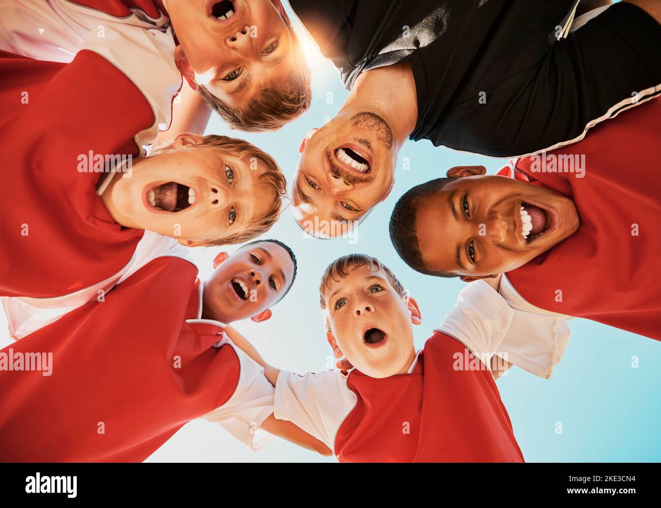 Soccer, team and coach in huddle, celebration and happy with smile ...