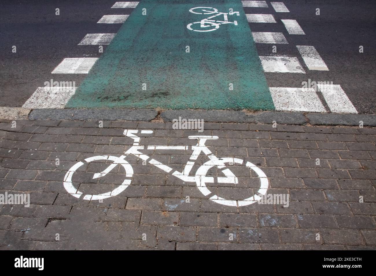 Bicycle path sign on paving slabs close up Stock Photo - Alamy