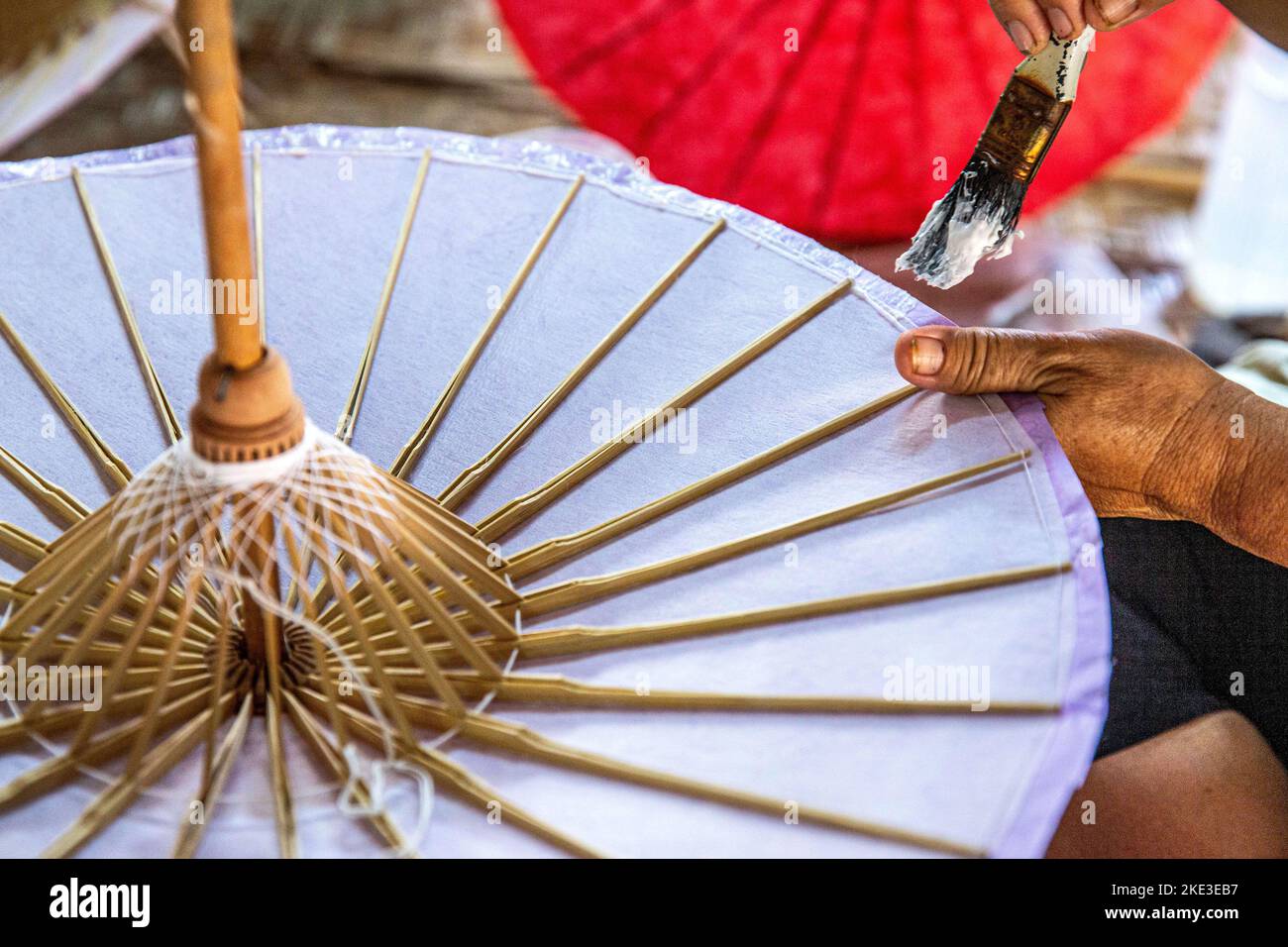 Chiang Mai, Thailand. 9th Nov, 2022. An artisan makes a paper umbrella ...