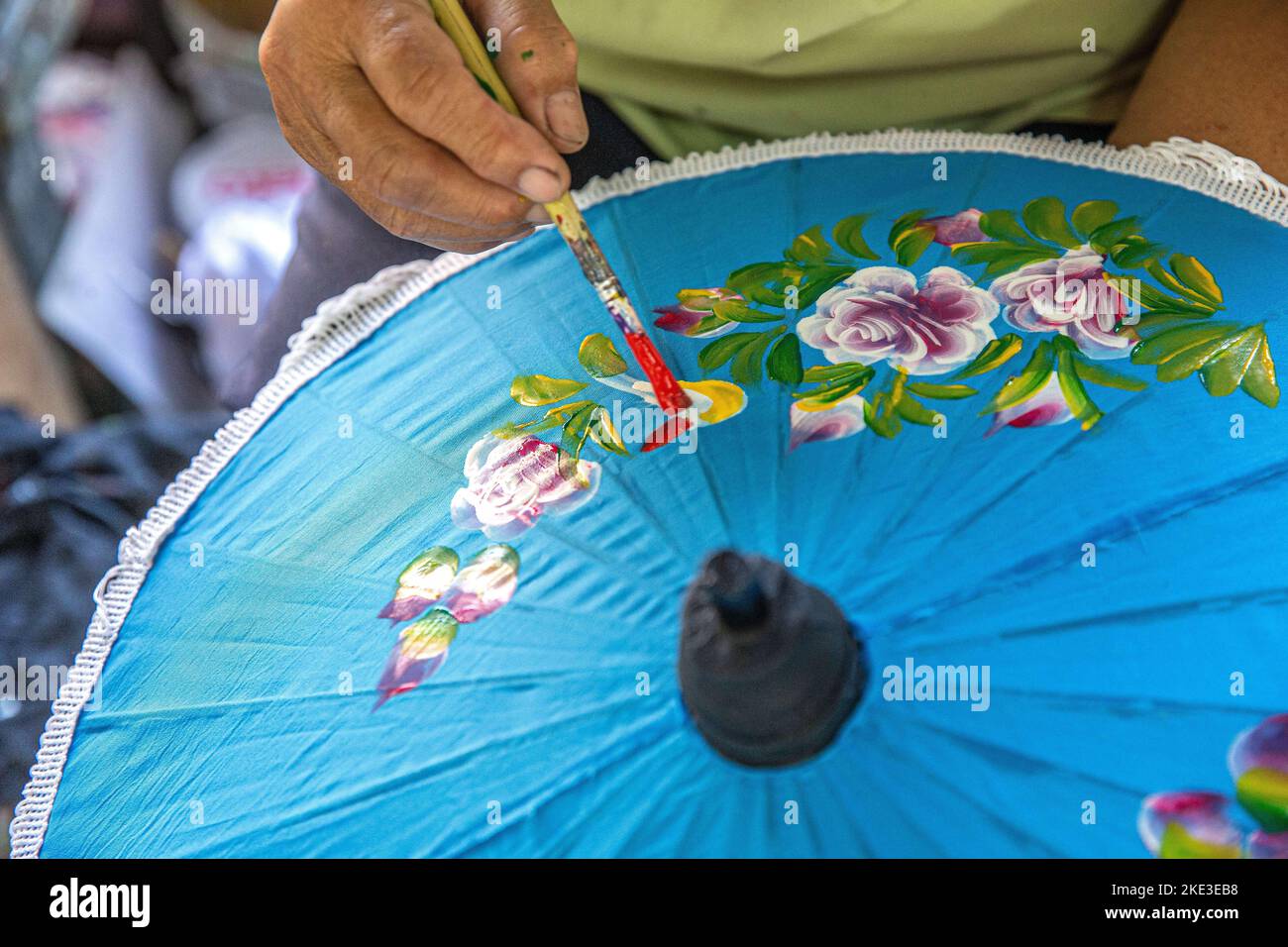 Chiang Mai, Thailand. 9th Nov, 2022. An artisan makes a paper umbrella ...