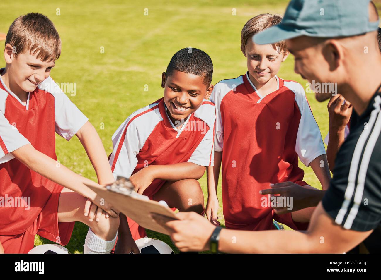 Soccer, children and coach with clipboard talking game plan, team ...