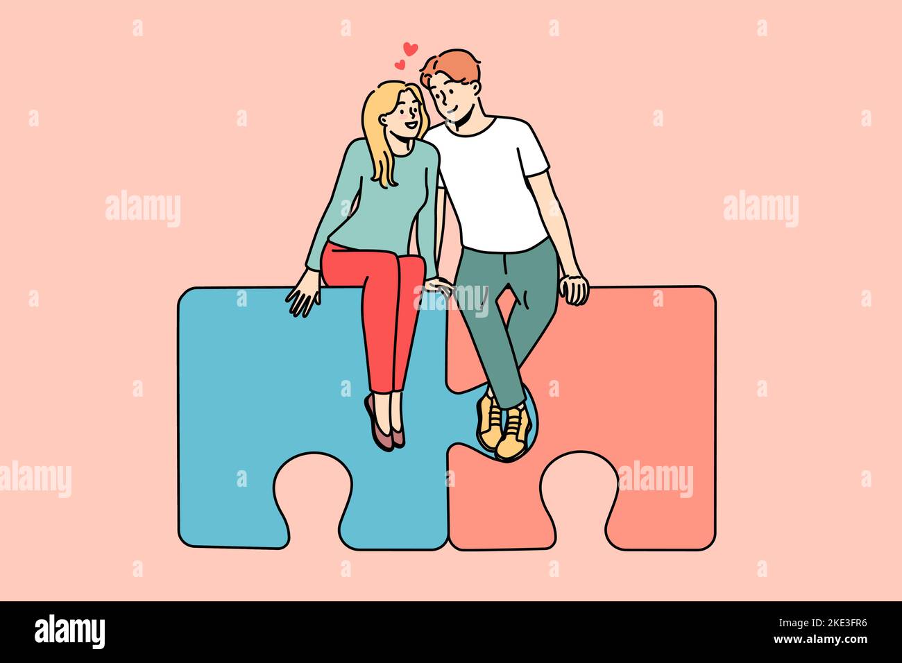 Happy couple sitting on jigsaw puzzles hugging. Smiling man and woman ...