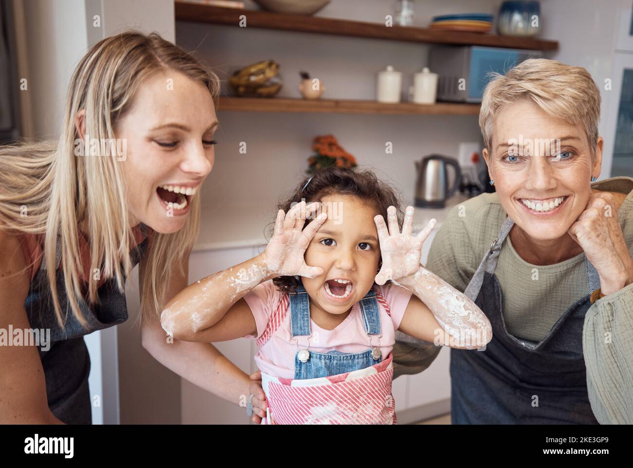 Happy, mother and grandmother with child baker hands in playful joy or ...