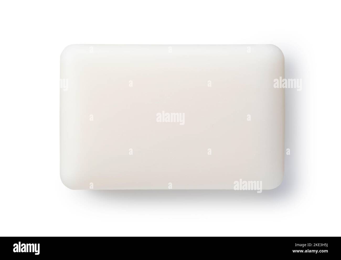 White solid soap placed on a white background. Viewed from directly ...