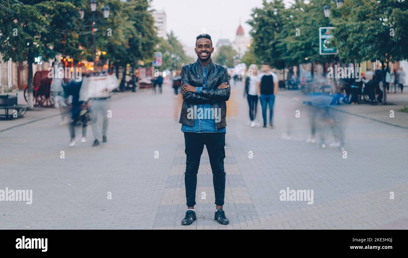 Person Standing Alone In Crowd