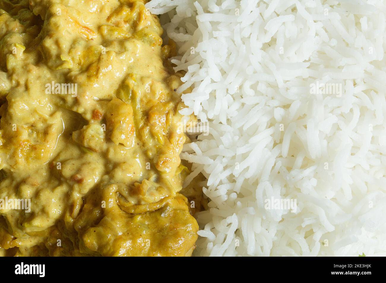 Split screen with a Close-up of chicken topped with tikka masala sauce ...