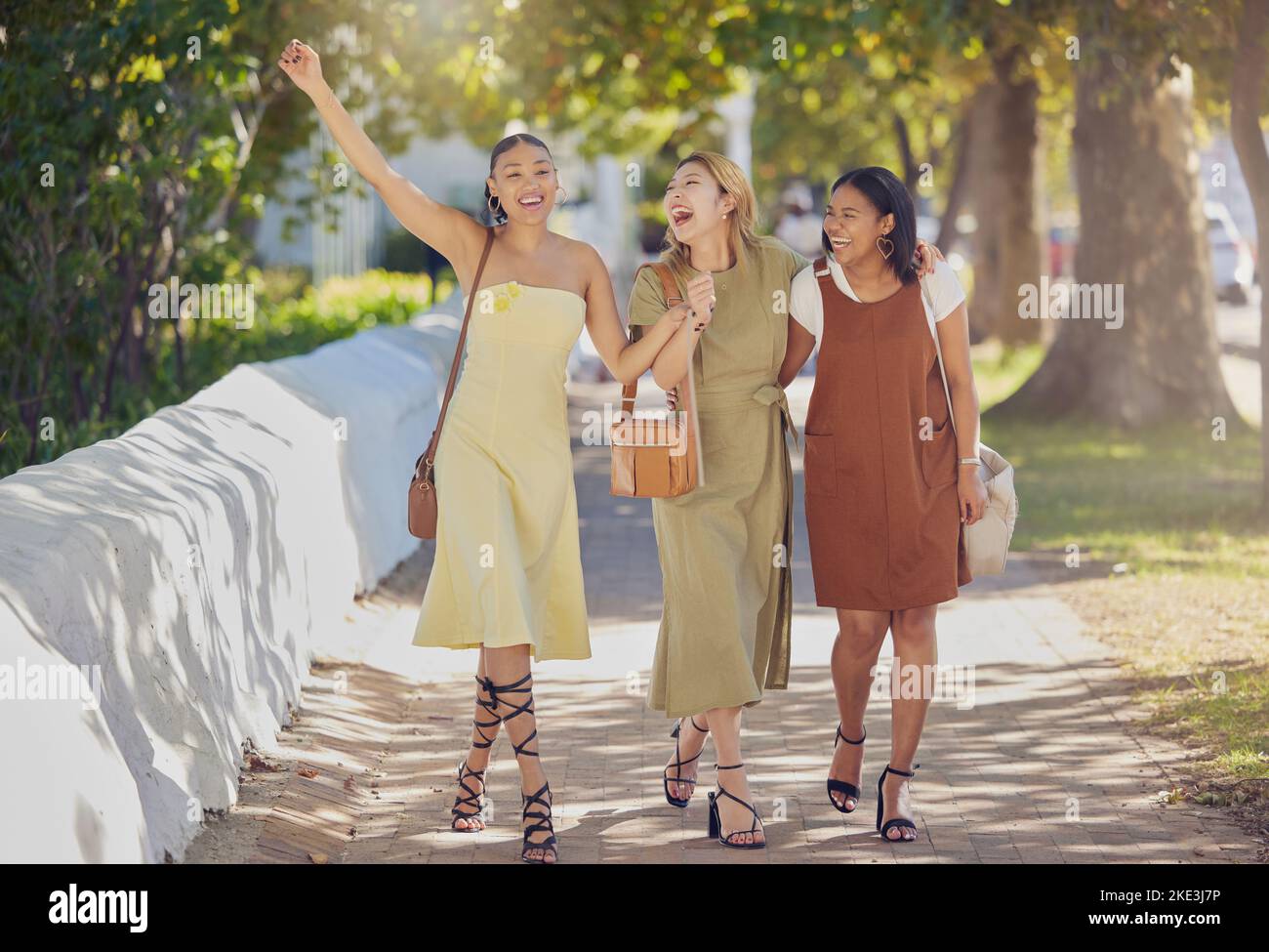 Friends, walking and park with a woman group outdoor in a formal garden ...