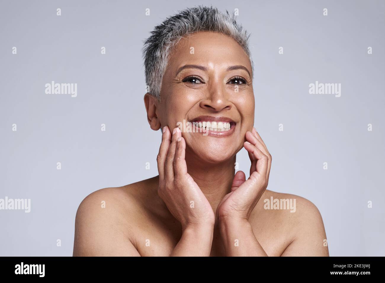 Face, hands and beauty with antiaging and woman, smile in portrait for ...