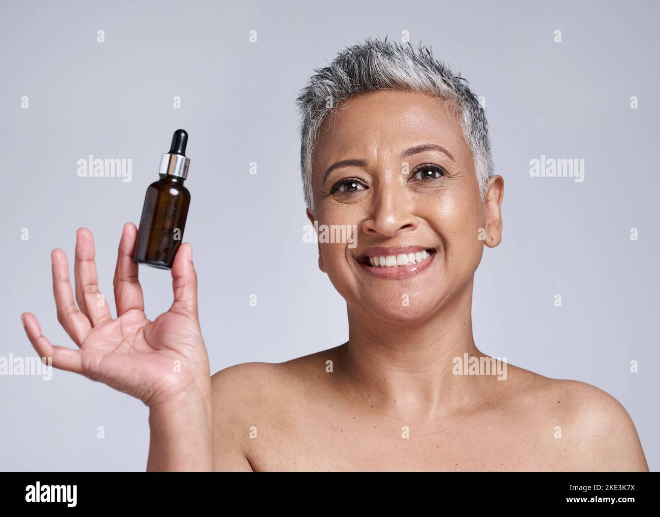 Senior woman, serum and skincare with smile for natural beauty, organic ...