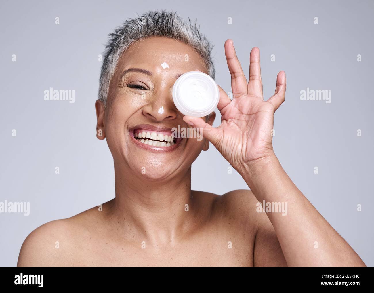 Skincare, beauty and happy woman with face cream for her skin routine ...