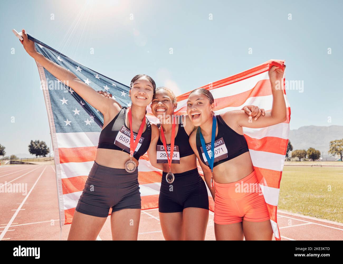 Winner, sports and usa with a woman team holding a flag after winning a ...