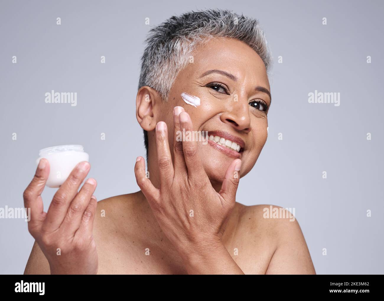 Mature woman, skincare cream and portrait, sunscreen makeup product and ...