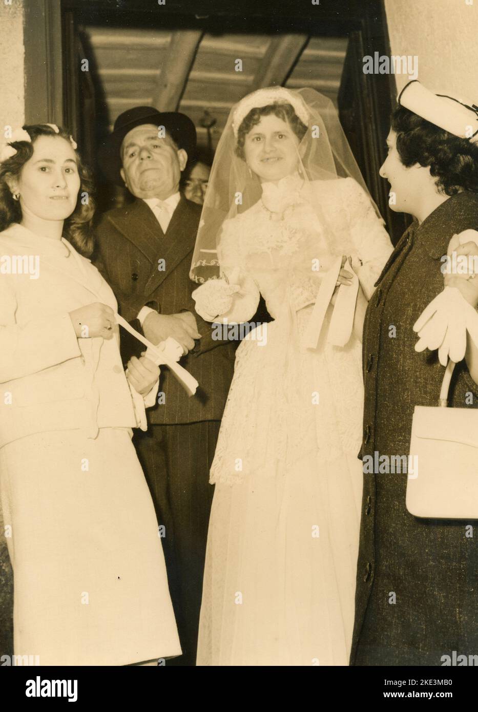 Wedding in a village in central Italy: The Bride gets out accompained ...