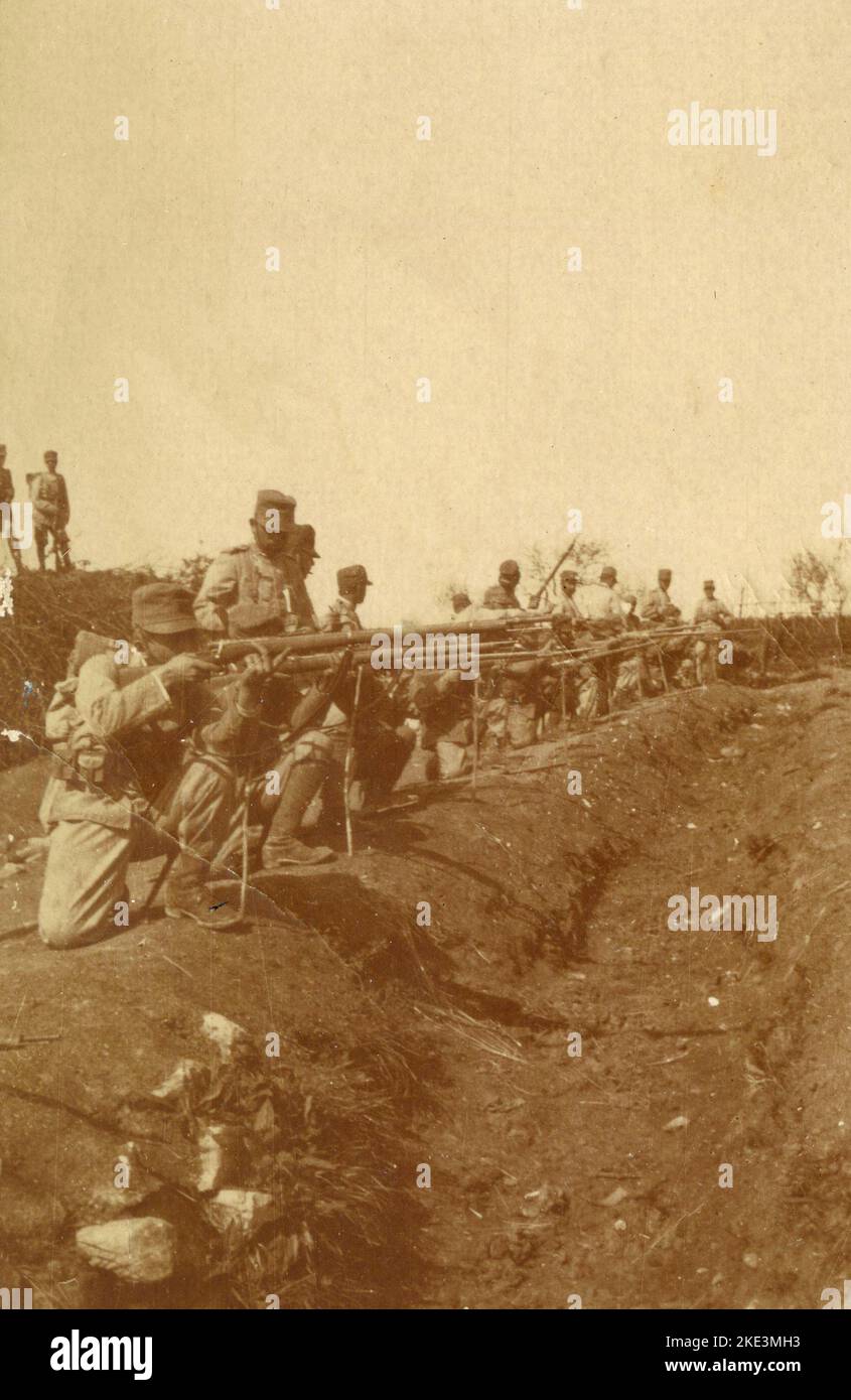Soldiers out of the trench aiming the guns, Italy 1910s Stock Photo - Alamy