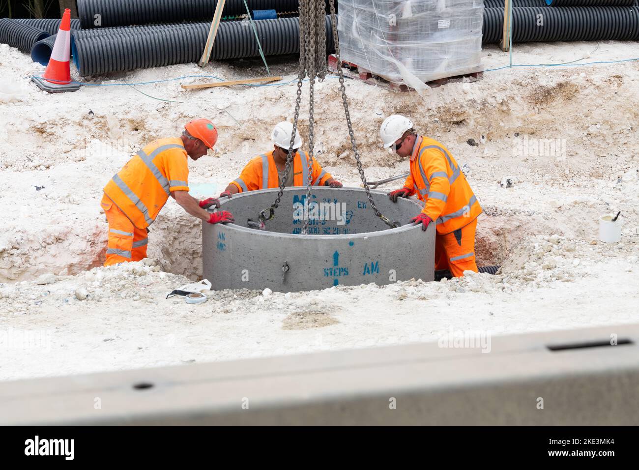 motorway construction workers installing an FP McCann precast concrete ...