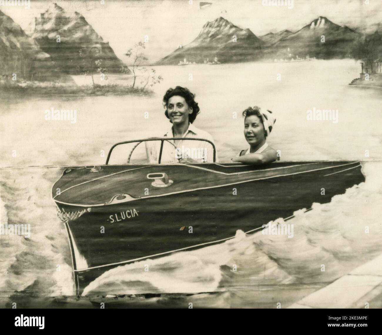 Two women in a staged photo with the marine background, Italy 1960s ...