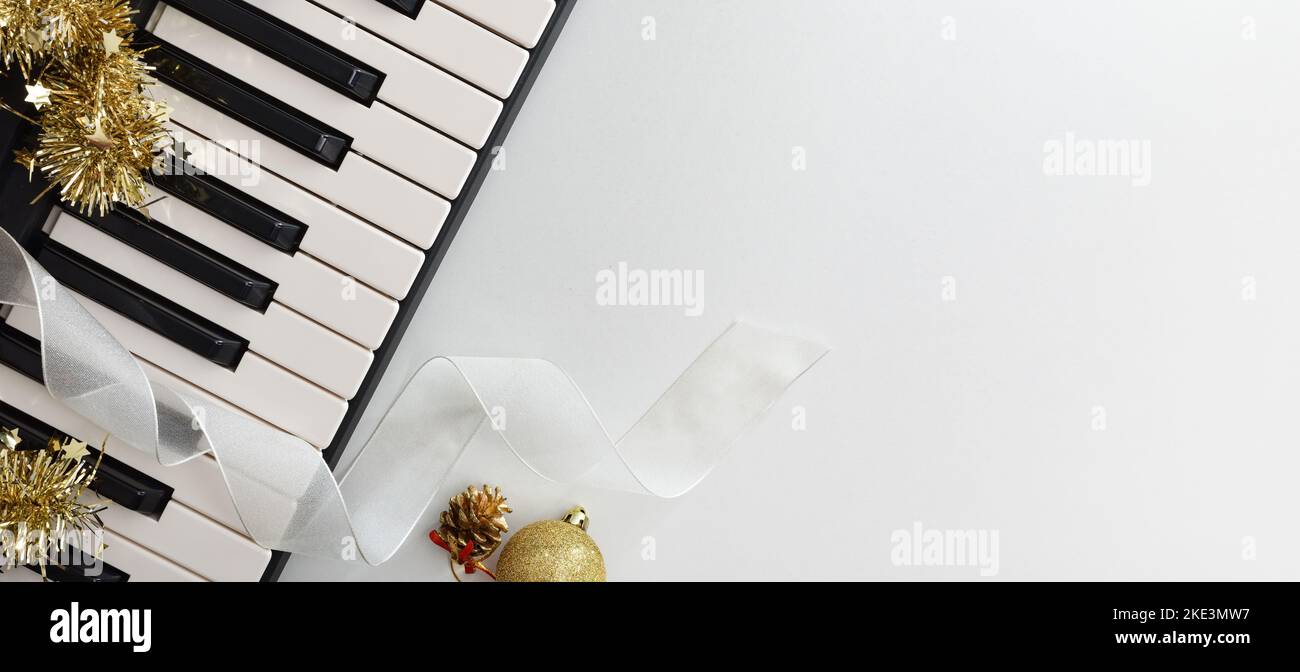 Christmas musical event concept background with piano on white table ...