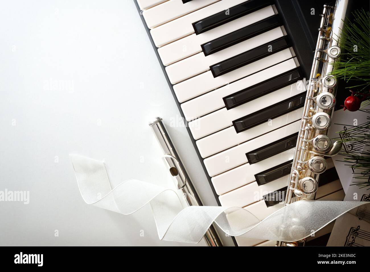 Christmas musical concert concept with piano and transverse flute with ...