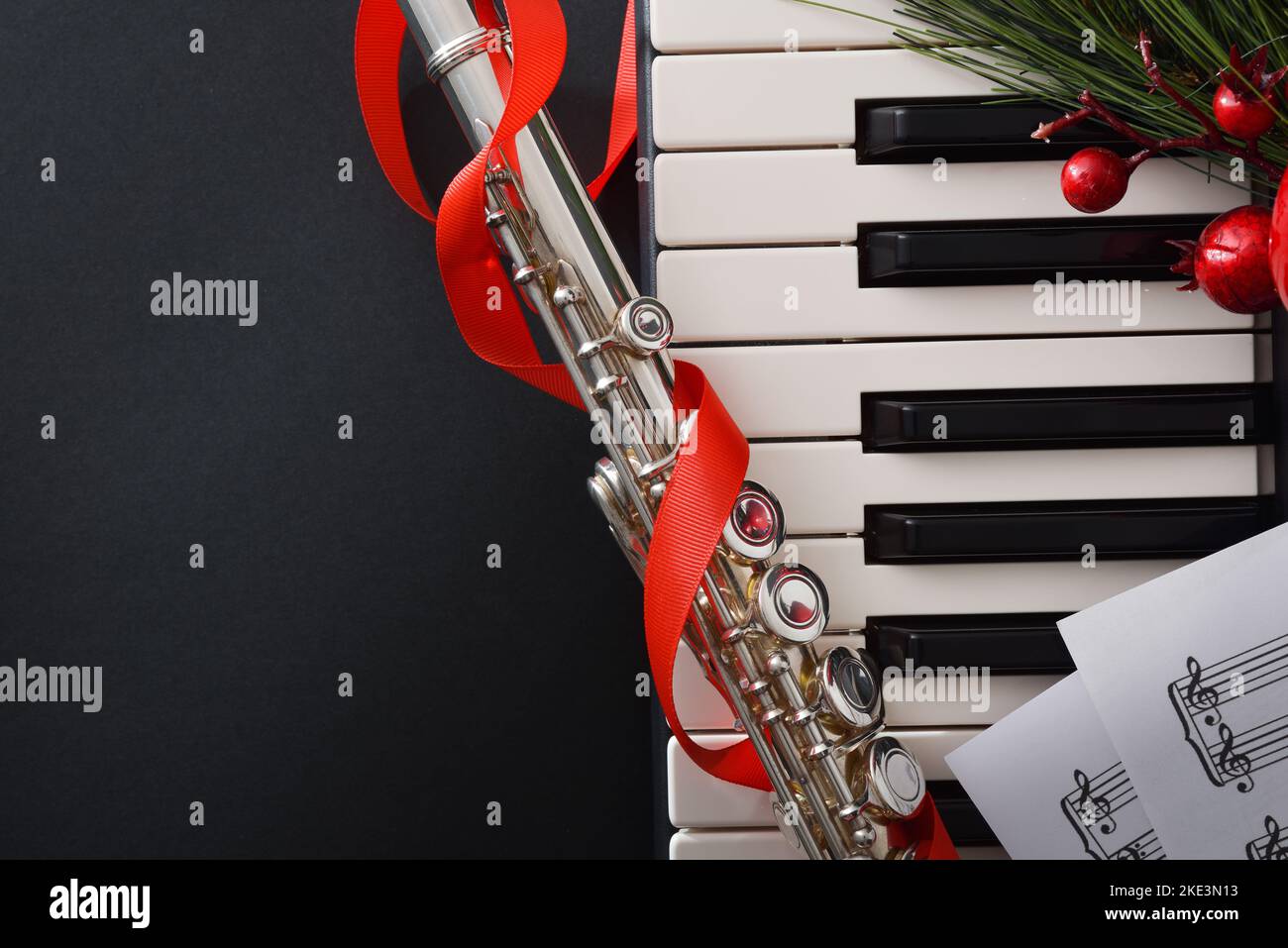 Christmas musical concert concept with detail of piano and transverse ...