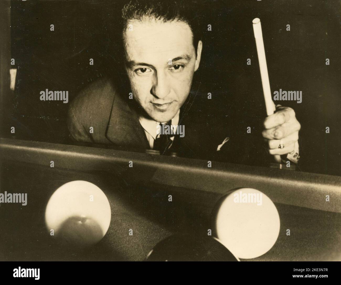Mexican billiard player José Enciso Ulloa AKA Joe Chamaco studying the ...