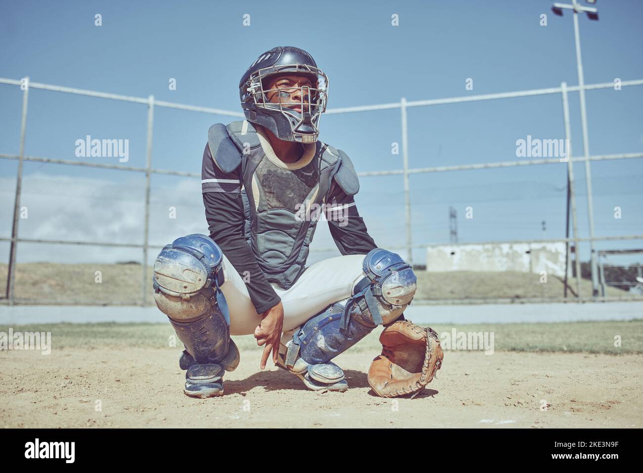 Baseball, fitness and catcher on a baseball field training for a sports ...
