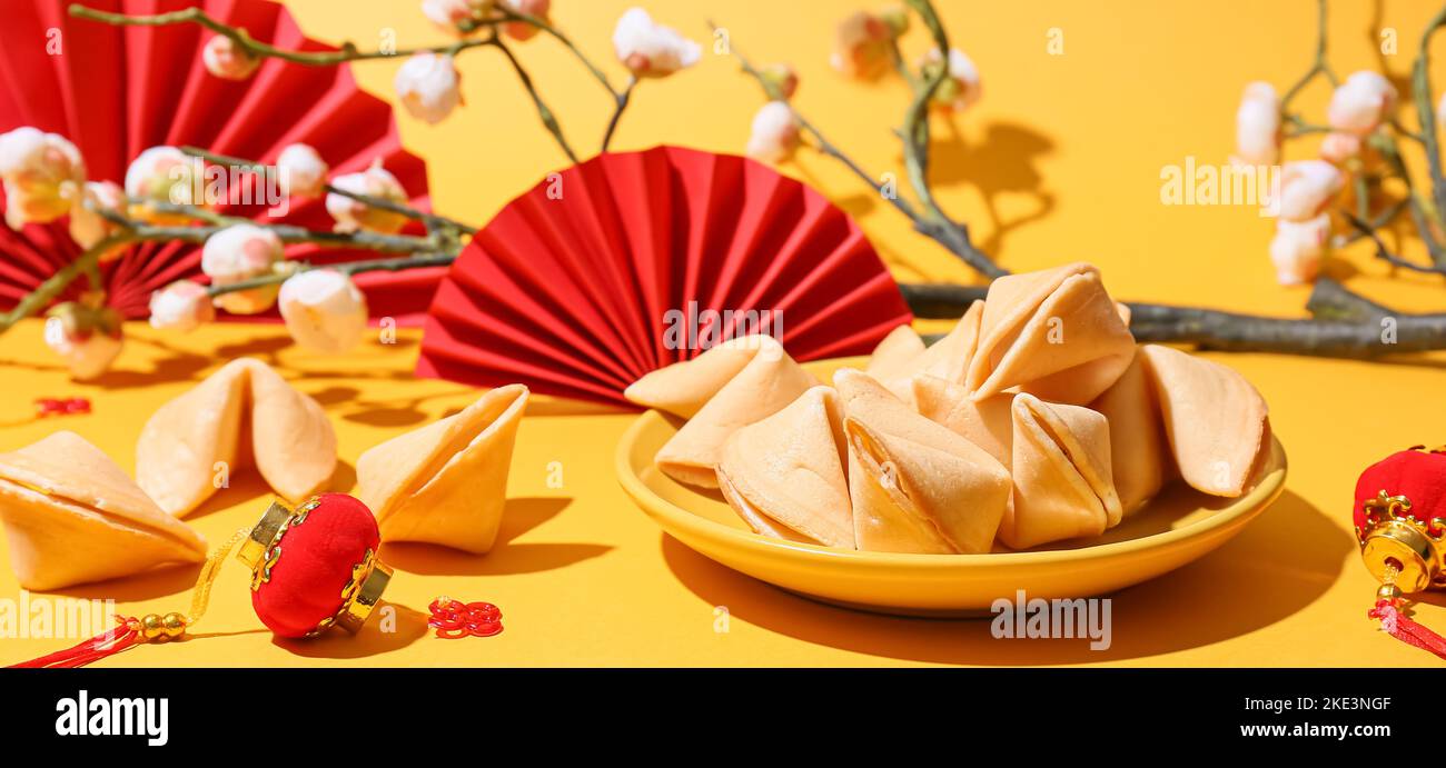 Composition with tasty fortune telling cookies and Chinese symbols on ...