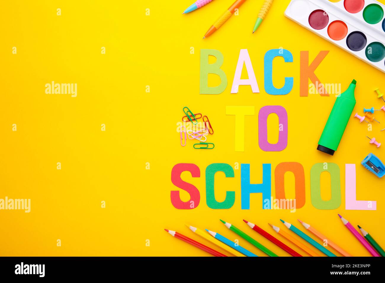 Inscription Back To School with school supplies on yellow. Education ...